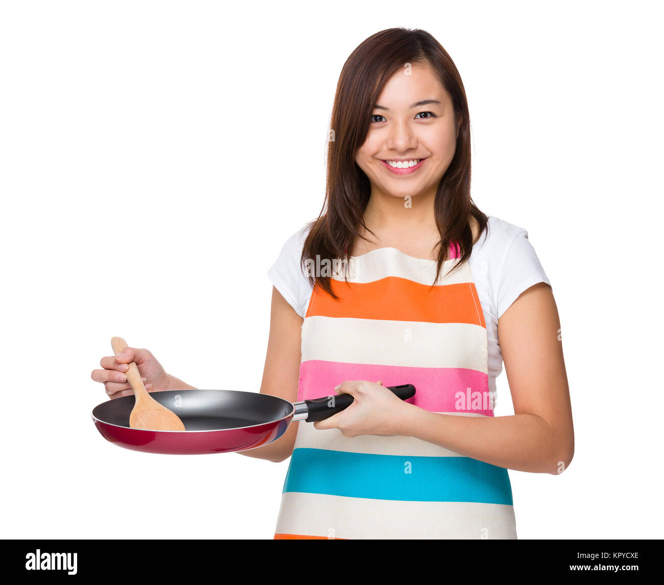 Young housewife using frying pan Stock Photo - Alamy