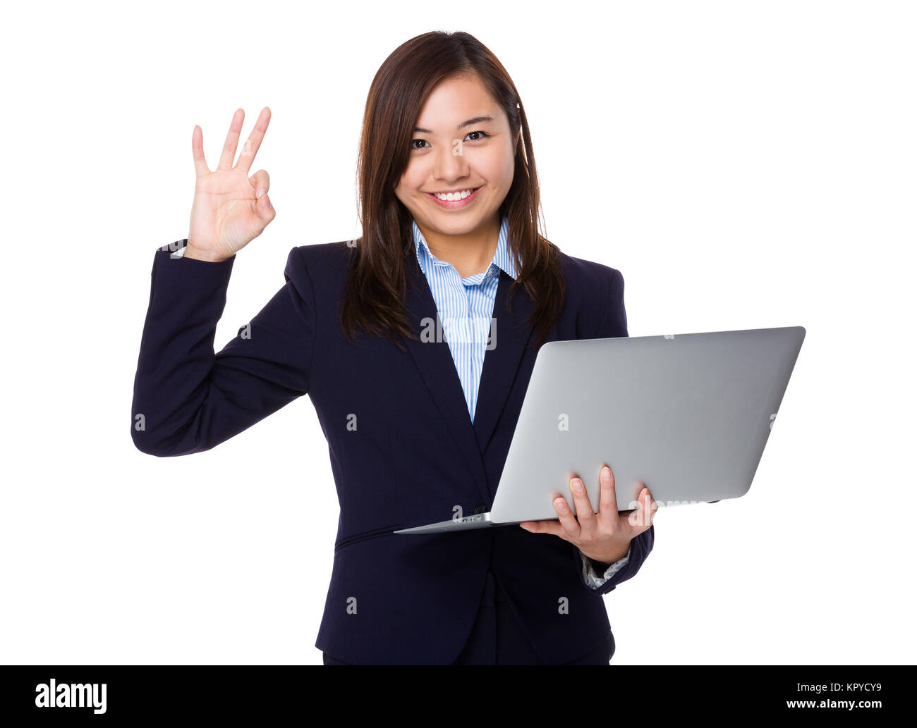 Young businesswoman use of the laptop computer and ok sign gesture Stock Photo - Alamy