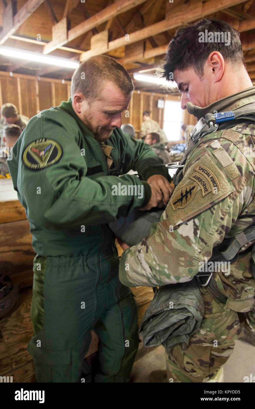A U.S. Army paratrooper receives jumpmaster personnel inspection during ...