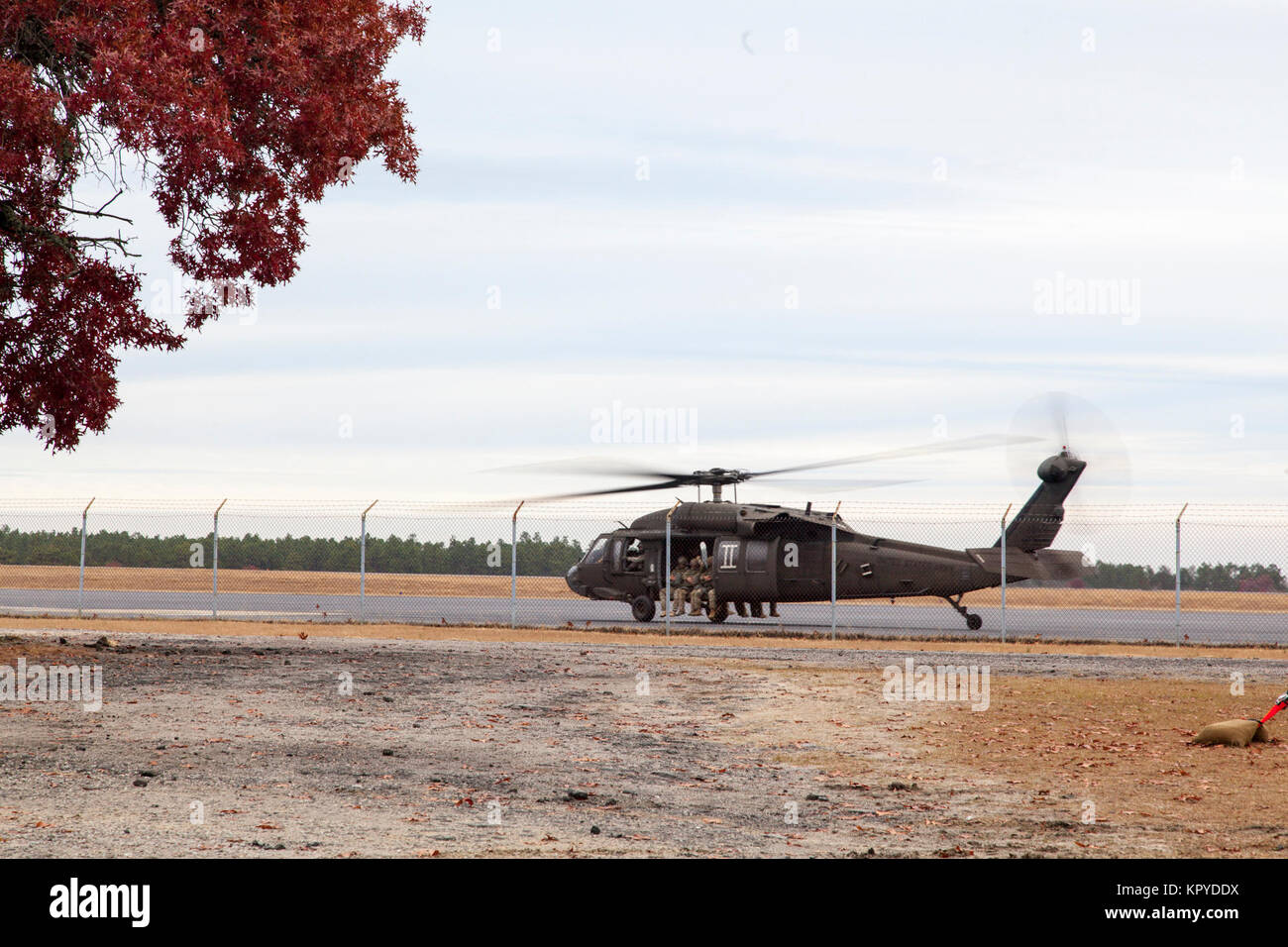 A UH-60 Blackhawk helicopter prepares to take off during the 20th ...
