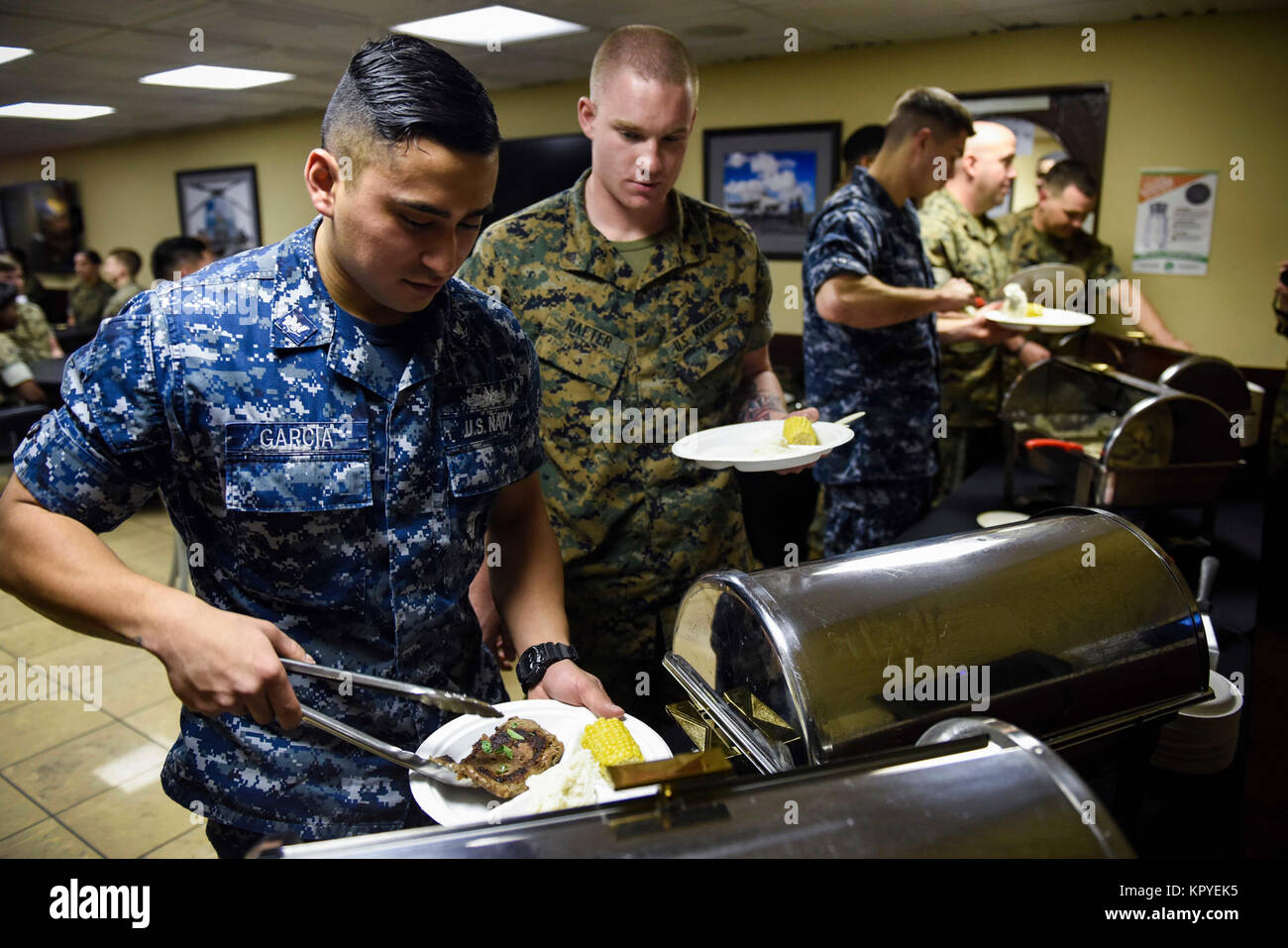 ARABIAN GULF (Dec. 7, 2017) Sailors and Marines load food on their ...
