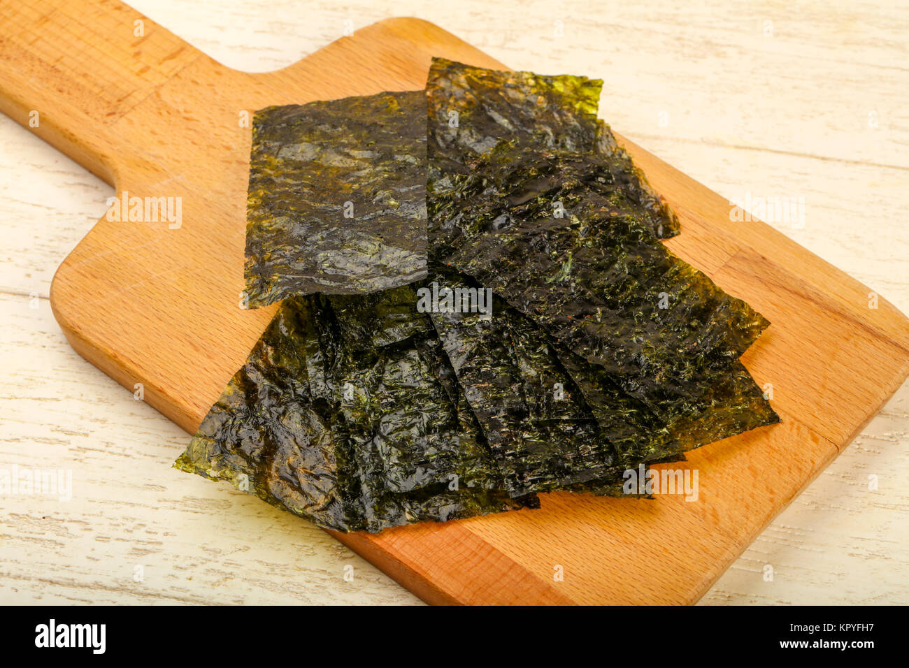 Crispy Nori sheets chips over wooden background Stock Photo - Alamy