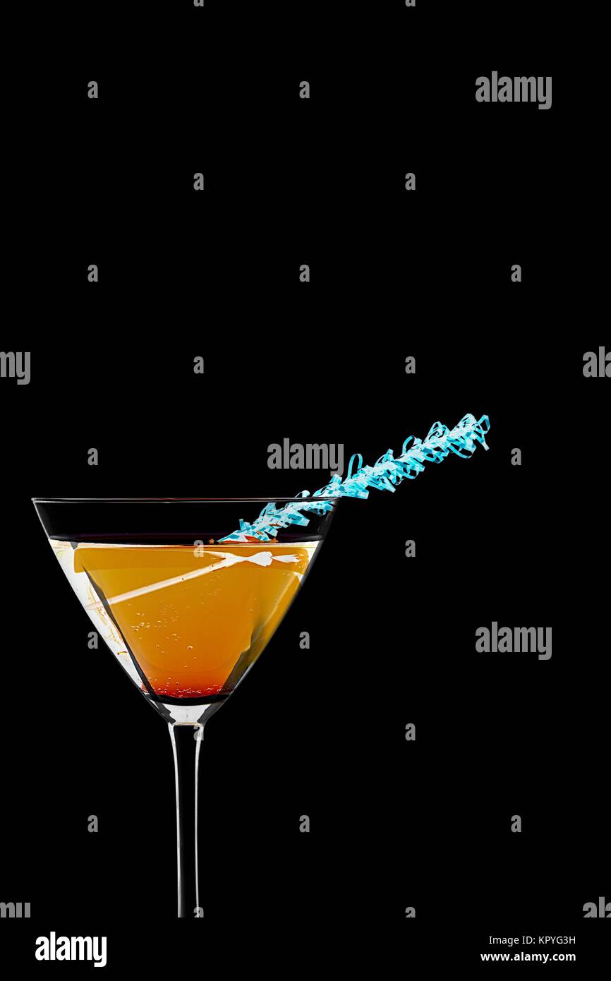 martini drink with streamer on dark background Stock Photo - Alamy