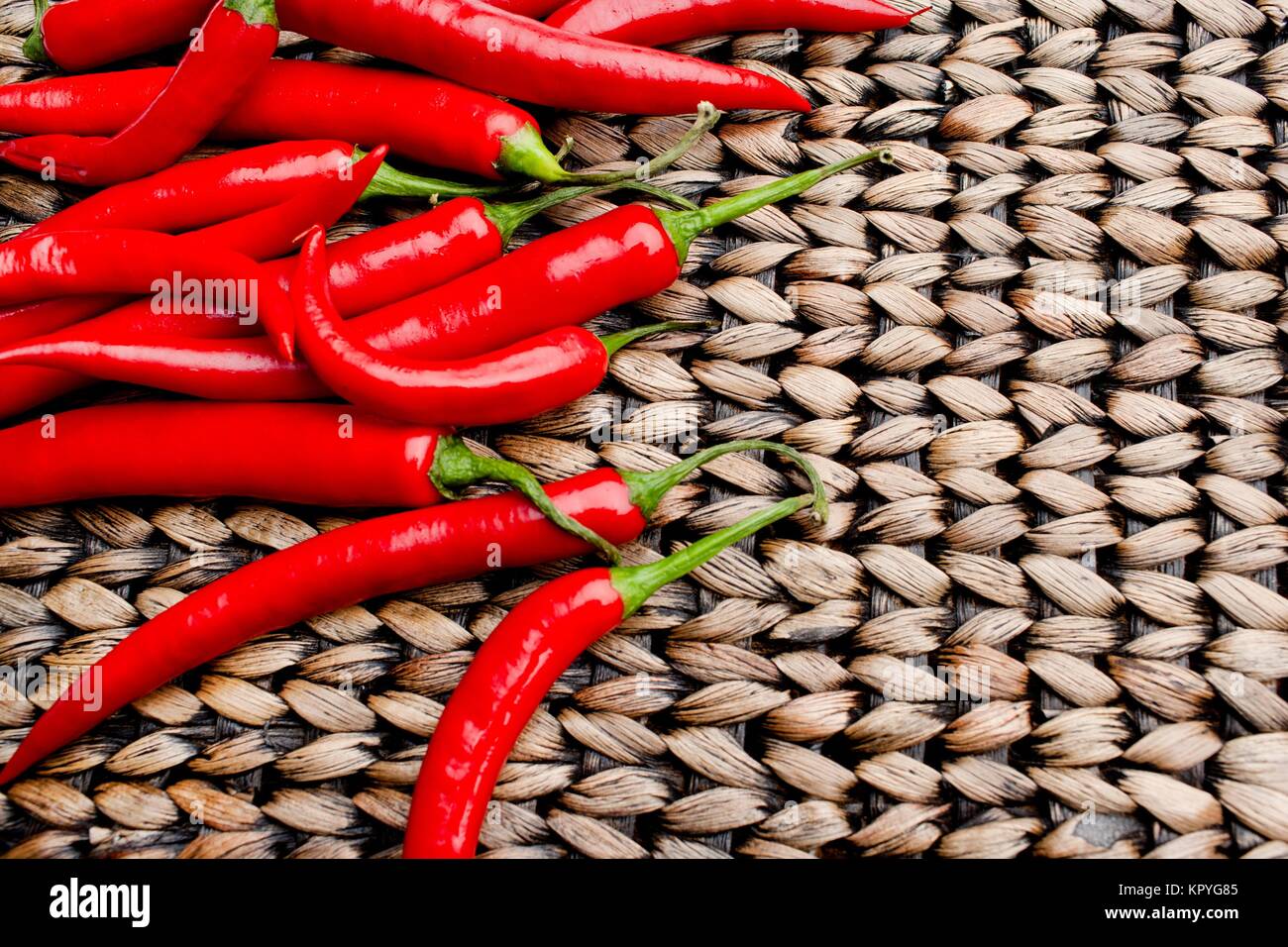 Multiple Chillis on a Patterned Surface Stock Photo - Alamy