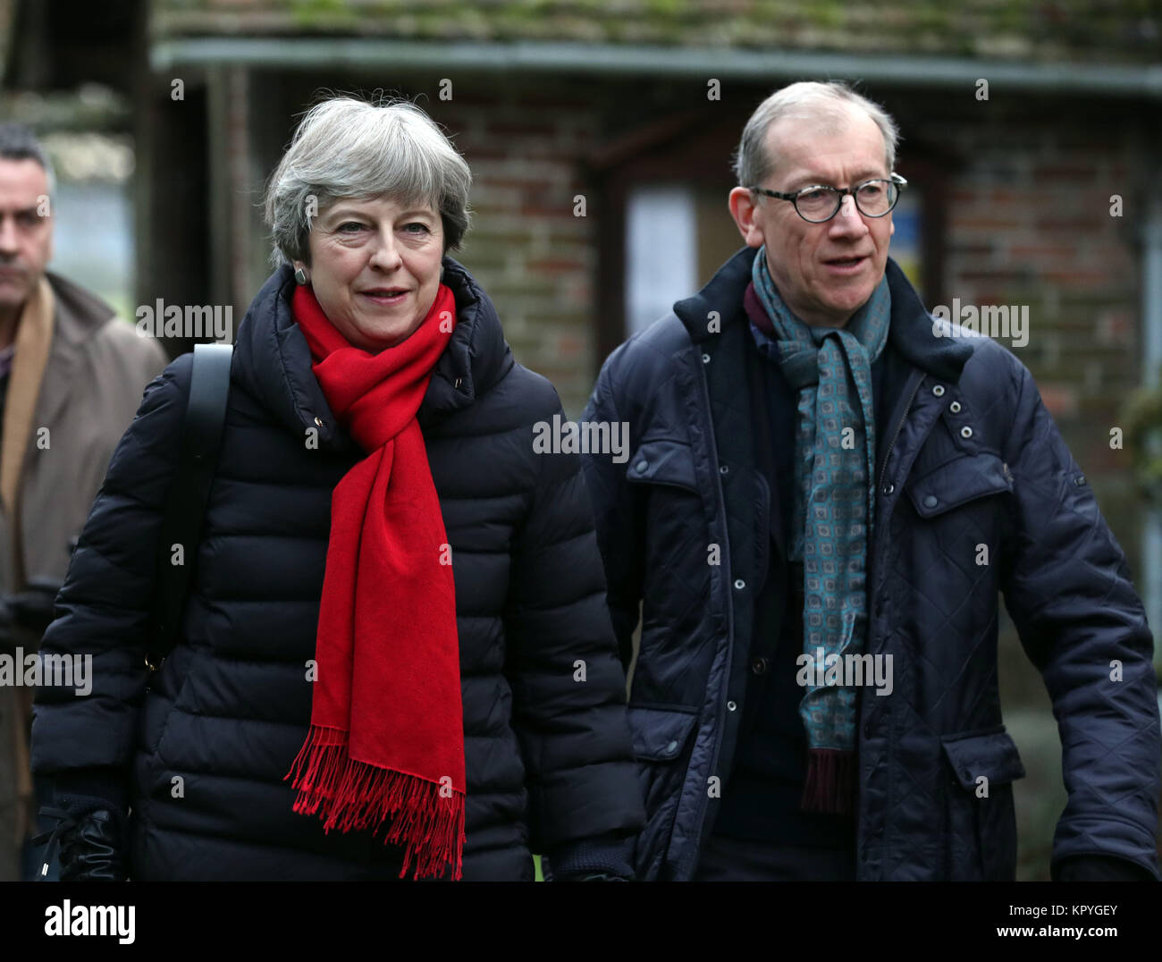 Prime Minister Theresa May and her husband Philip (right) leave after ...