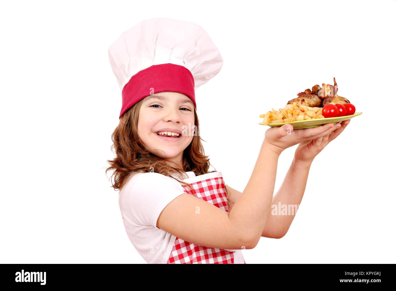happy little girl cook with roasted chicken wings on plate Stock Photo ...