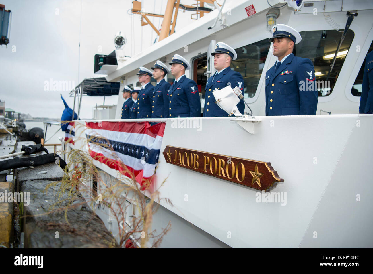 Coast Guard Cutter Jacob Poroo's crew mans the rail during the ship's ...