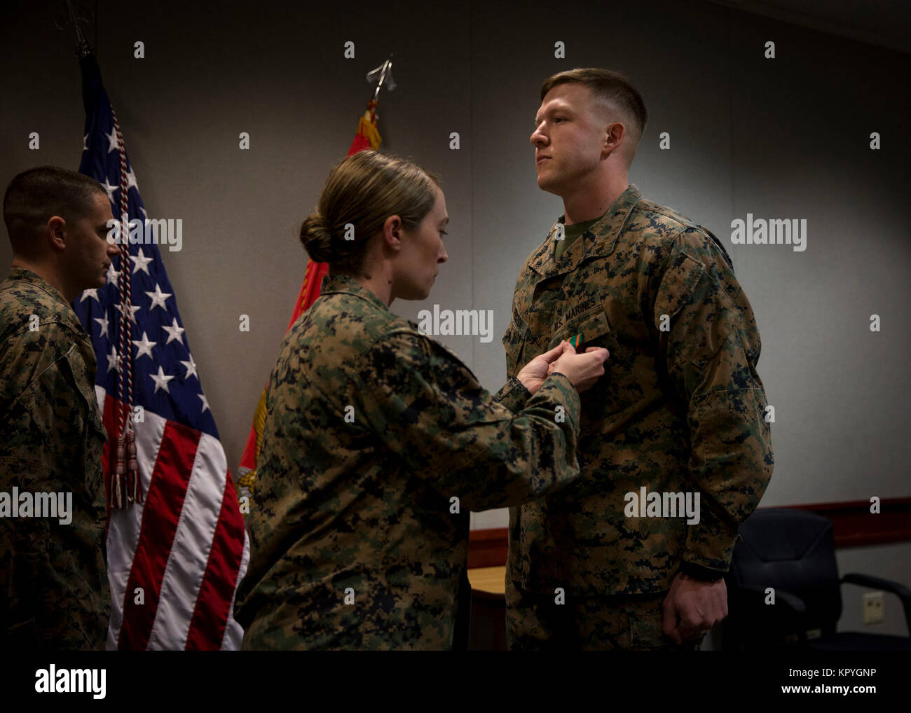 U.S. Marine Corps Lt. Col. Taunja M. Menke, center, commanding officer ...