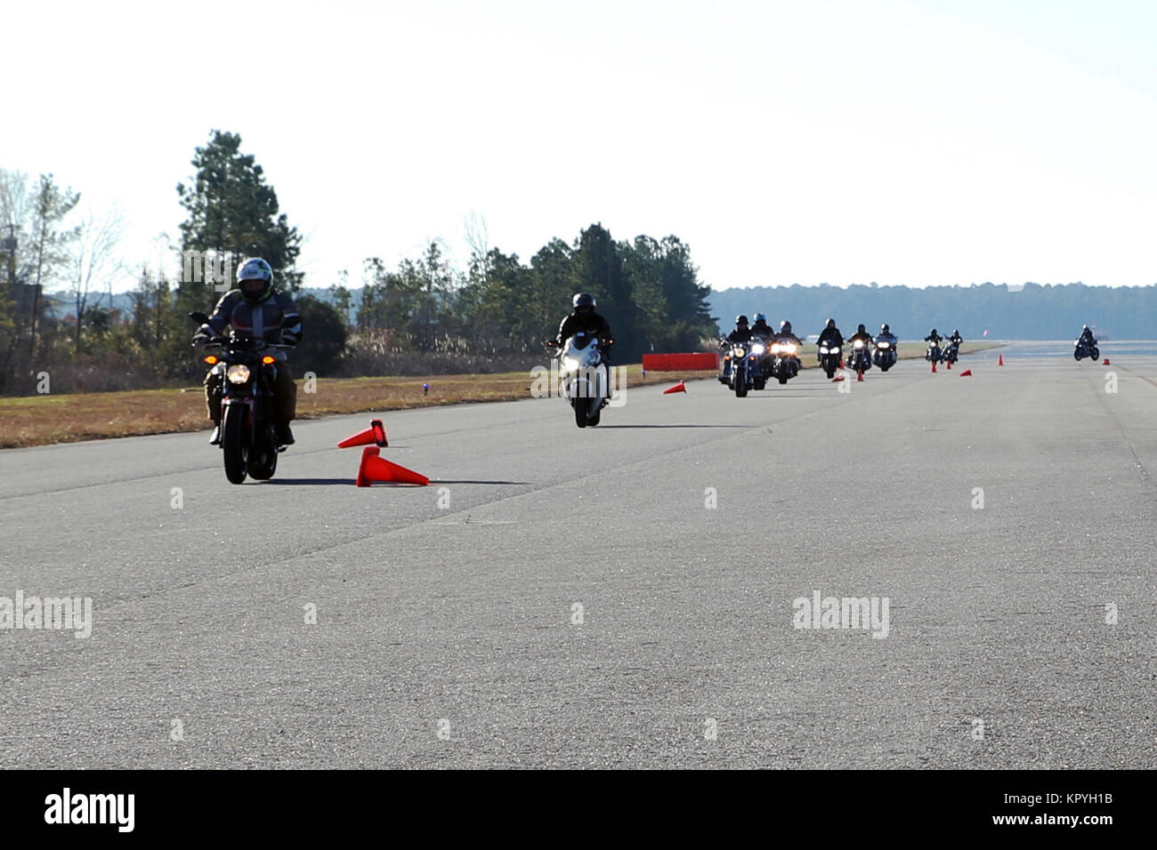 Students take familiarization laps around a training course during a ...
