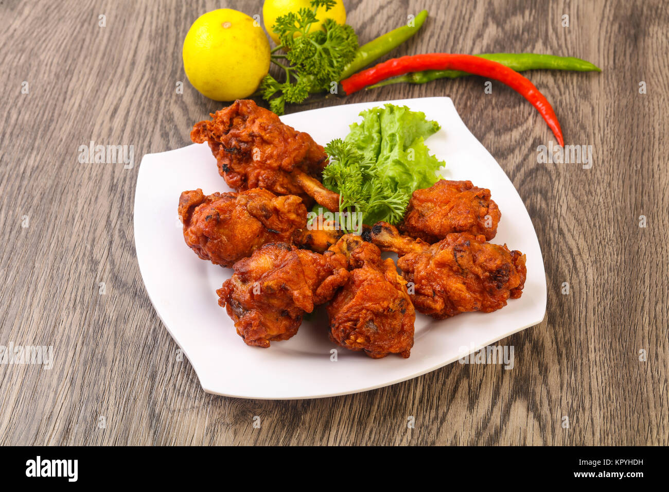 Indian traditional cuisine - Chicken lollipops with spices Stock Photo ...