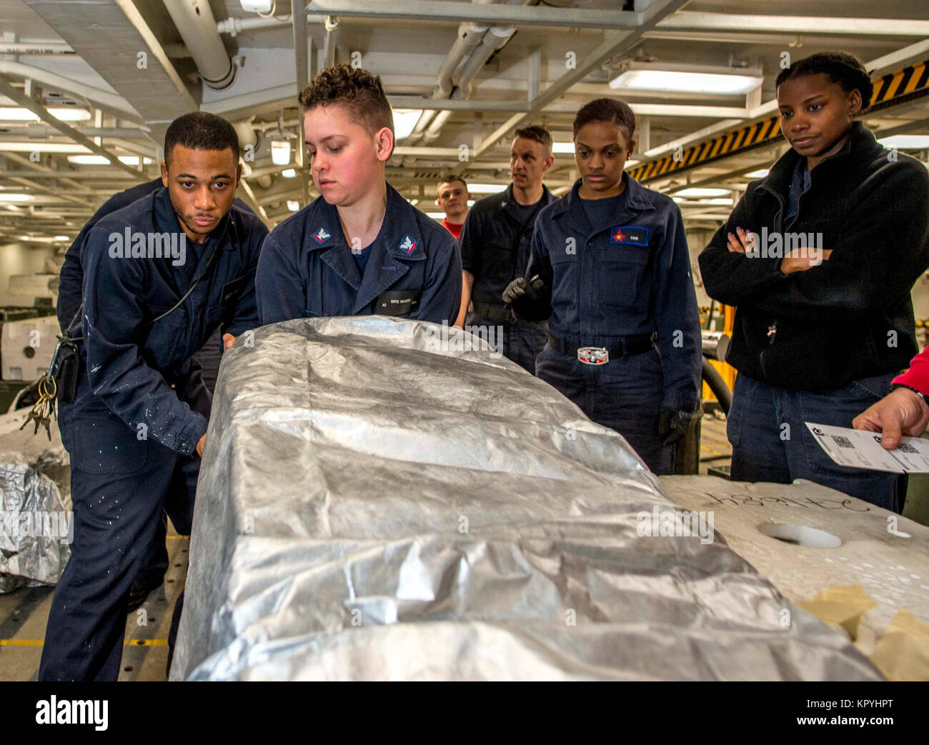 ATLANTIC OCEAN (Dec. 12, 2017) Sailors seal KMU bomb shell kits aboard ...