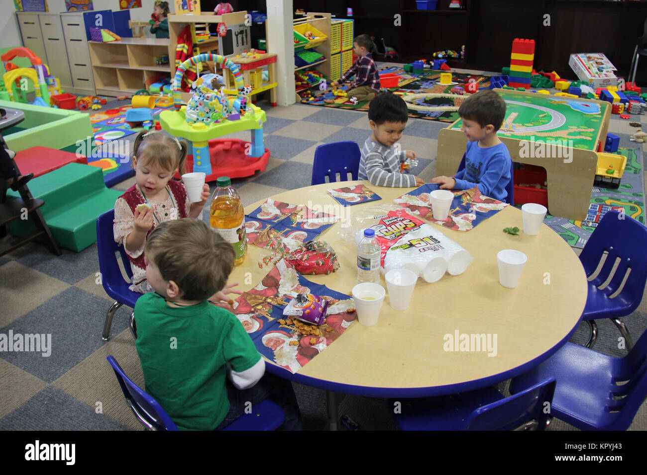 Fort McCoy Family members have a snack during the Dec. 12, 2017 ...