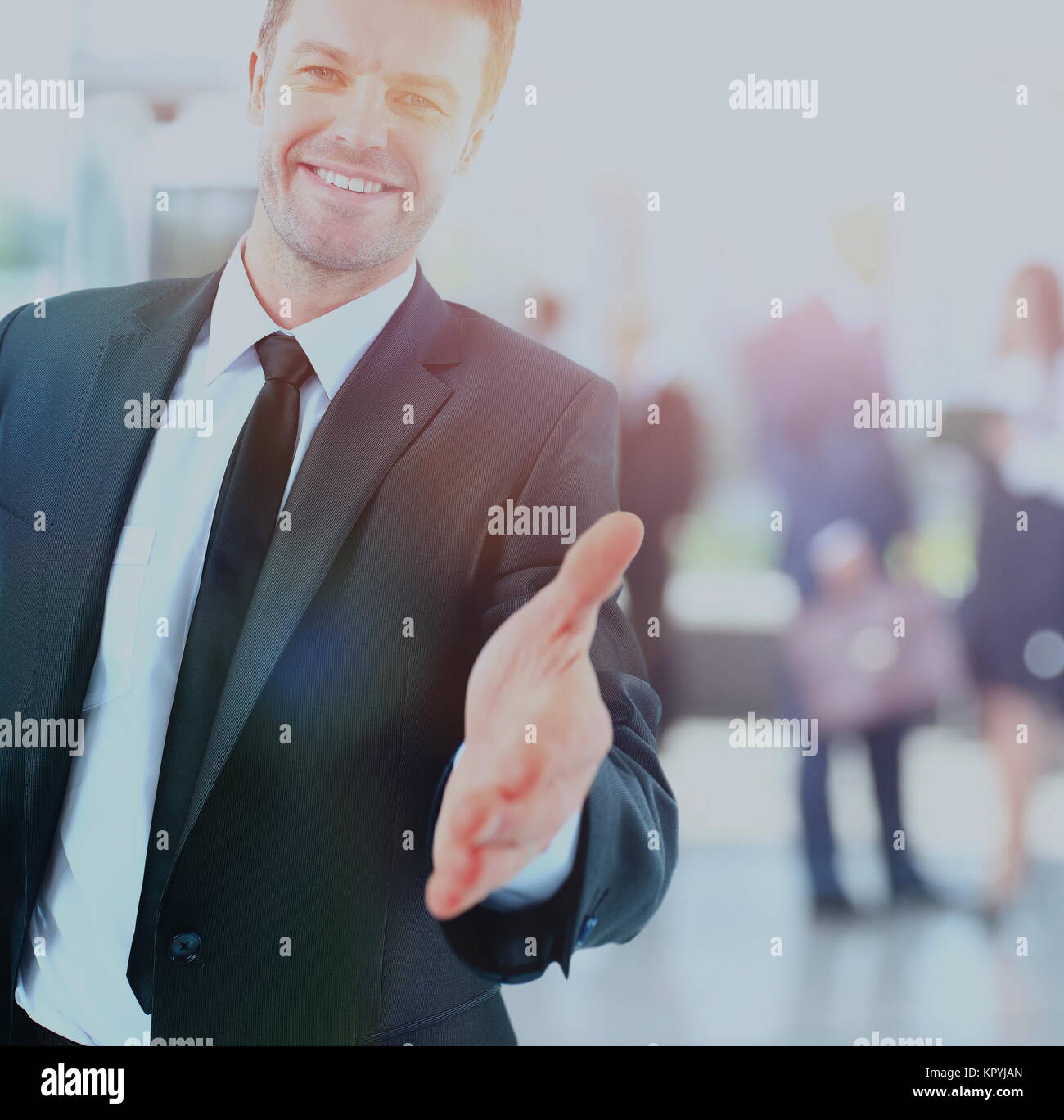 Portrait of a successful businessman giving a hand Stock Photo - Alamy