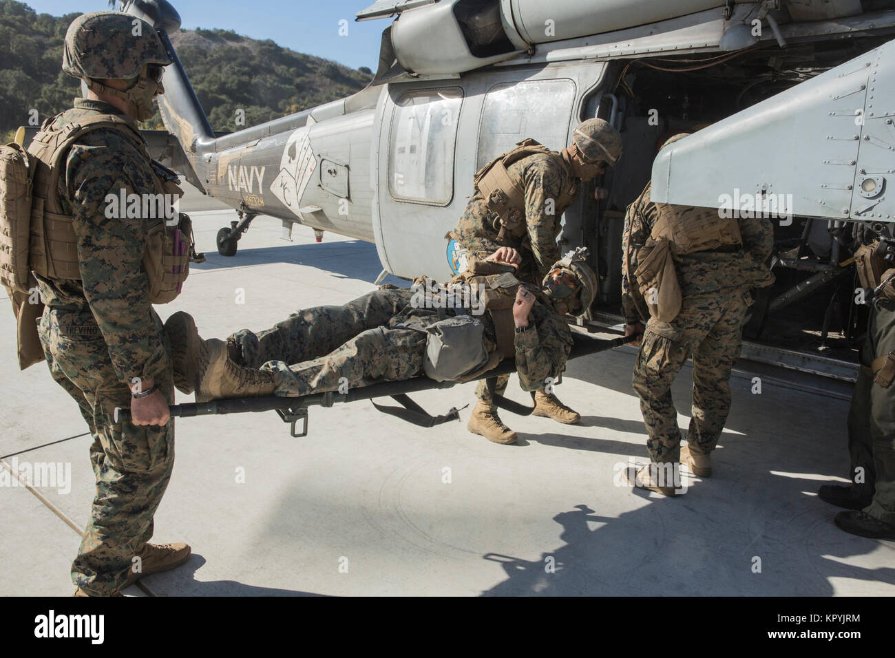U.S. Marines with the Advanced Infantry Unit Leaders Course evacuate a ...