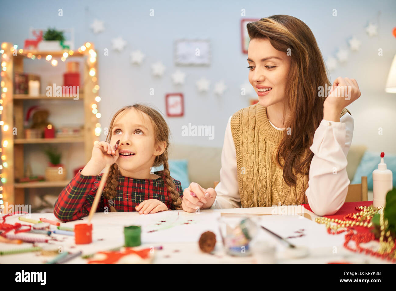 Joint Work on Creation of Christmas Decoration Stock Photo - Alamy