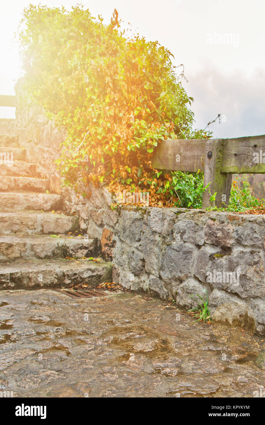 Ancient stone ladder in beams of the sun. Decline, close up, selective ...