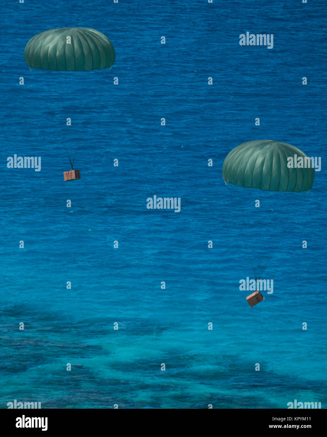 U.S. Air Force C-130 cargo aircraft deliver packages during Operation ...