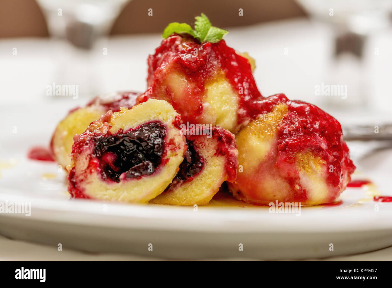 Traditional czech blueberry dumplings with raspberry coulis Stock Photo ...