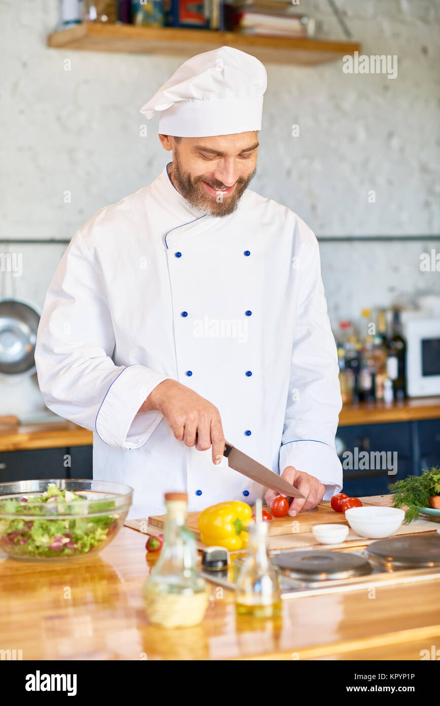 Cheerful Chef Working in Restaurant Kitchen Stock Photo - Alamy
