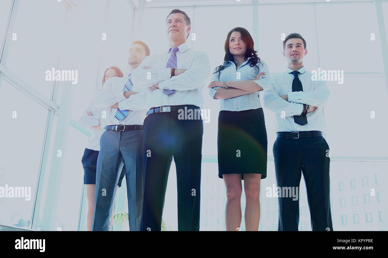 Portrait of businessman leading his team at office Stock Photo - Alamy