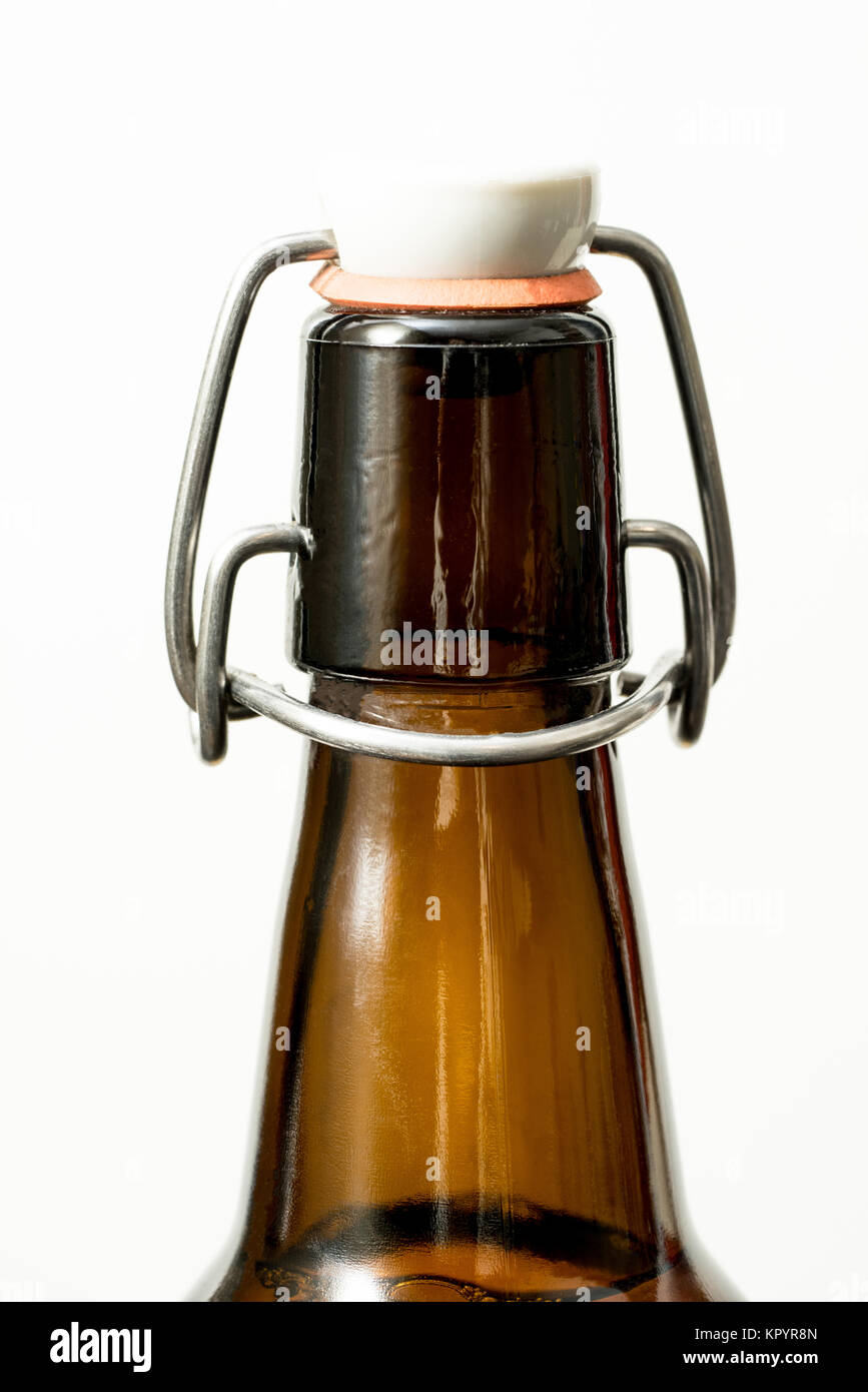 Brown glass bottle and marble cap, white background Stock Photo - Alamy