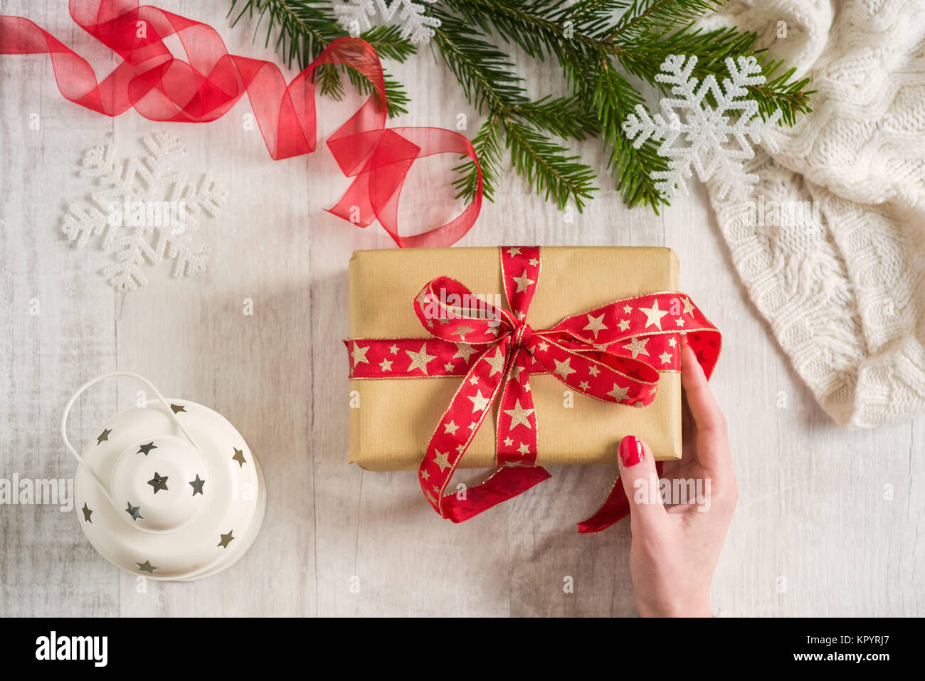 Female hands wrapping Christmas gifts Stock Photo - Alamy