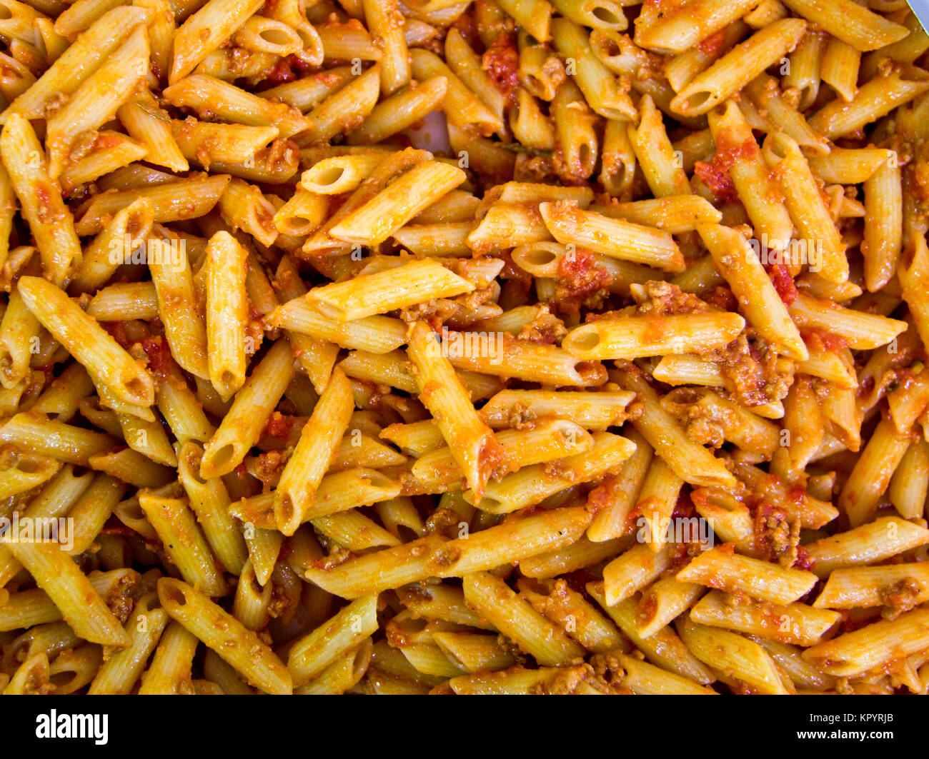 pasta seasoned with steaming meat sauce ready to be brought to the ...
