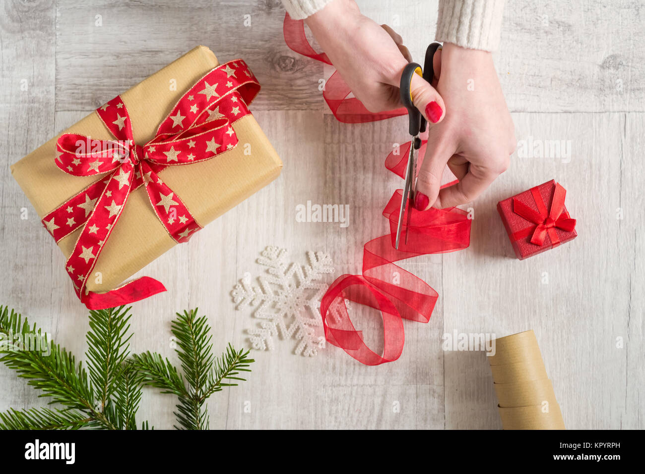 Female hands packing gifts hi-res stock photography and images - Alamy