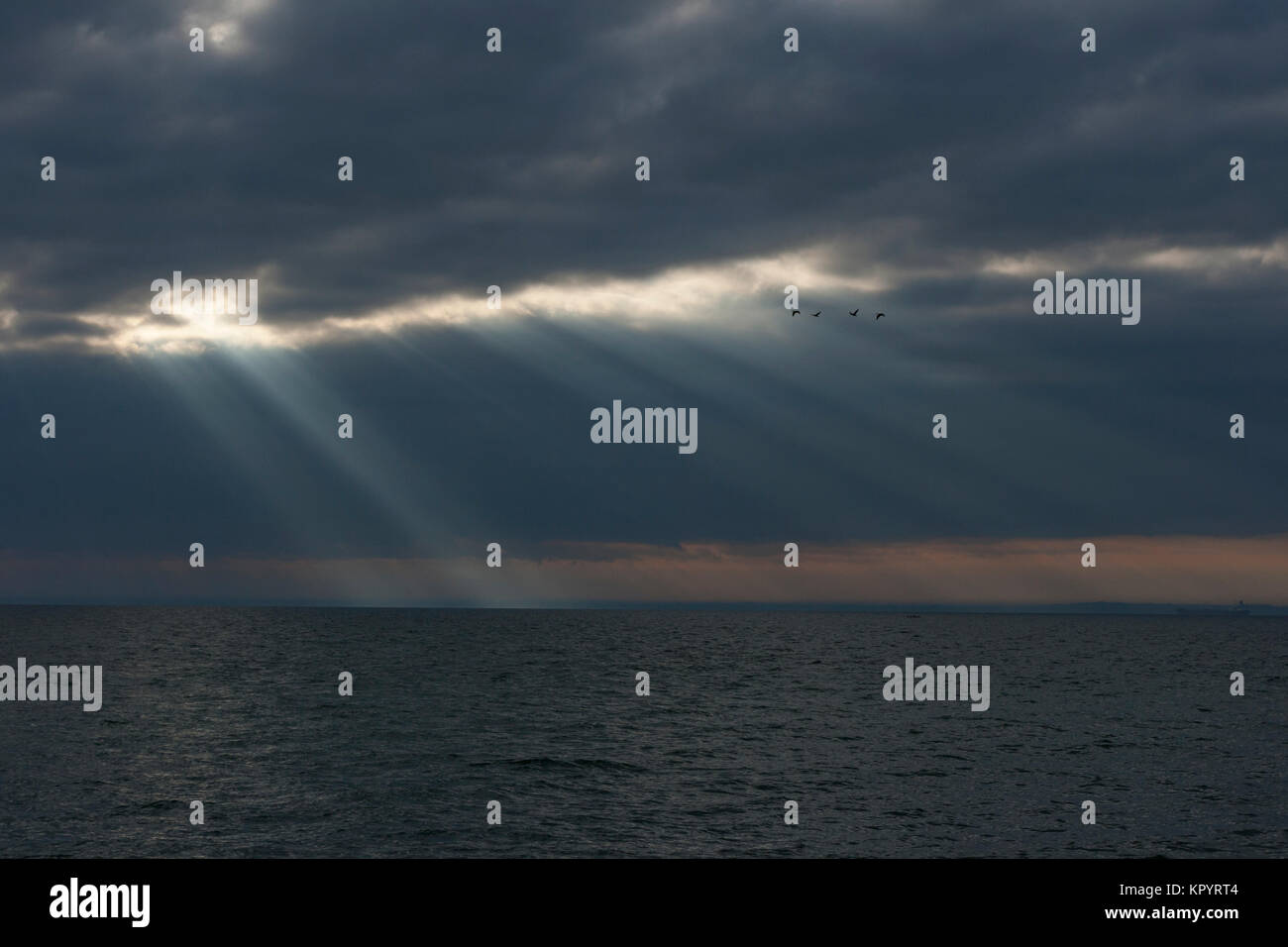 Sun rays coming through clouds hi-res stock photography and images - Alamy