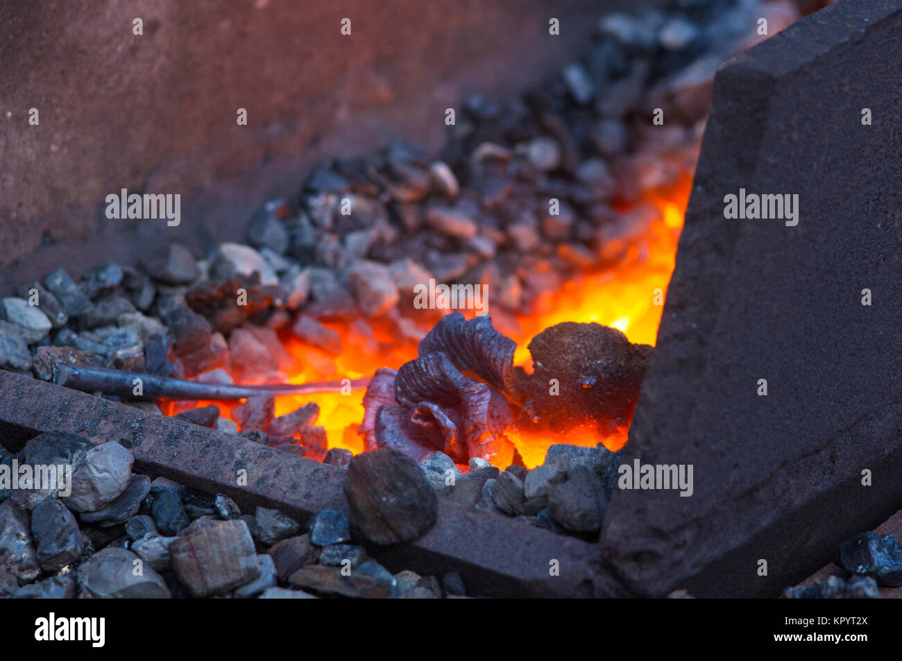 hot metal handmade unique iron rose in forge furnace, close-up Stock ...