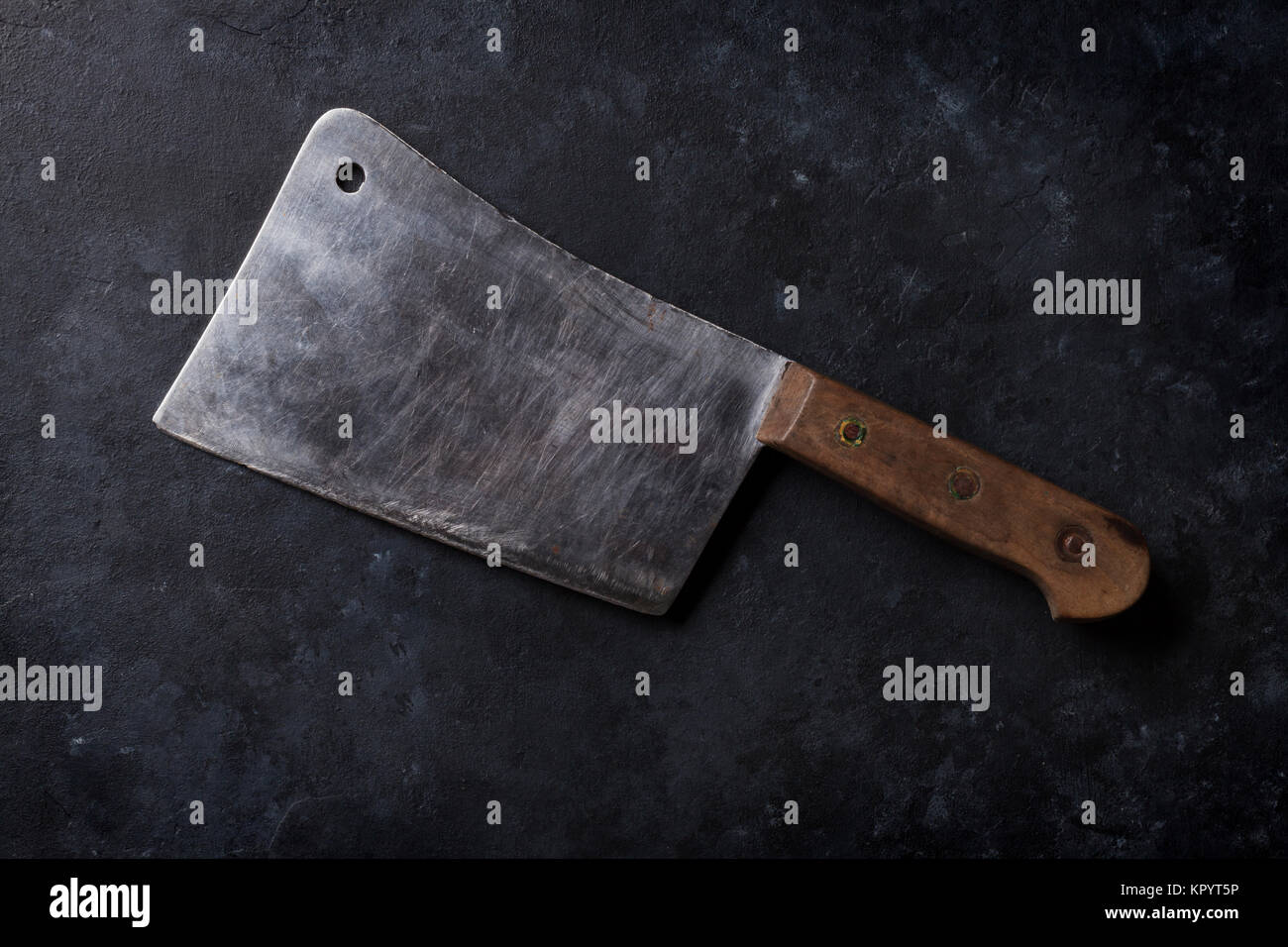 Butcher. Vintage meat knife over stone table. Top view Stock Photo - Alamy