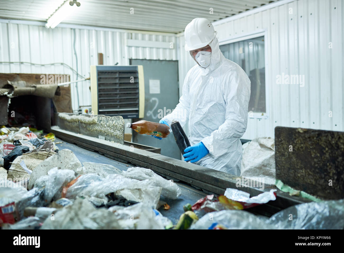 Worker Sorting Trash on Waste Processing Plan Stock Photo - Alamy