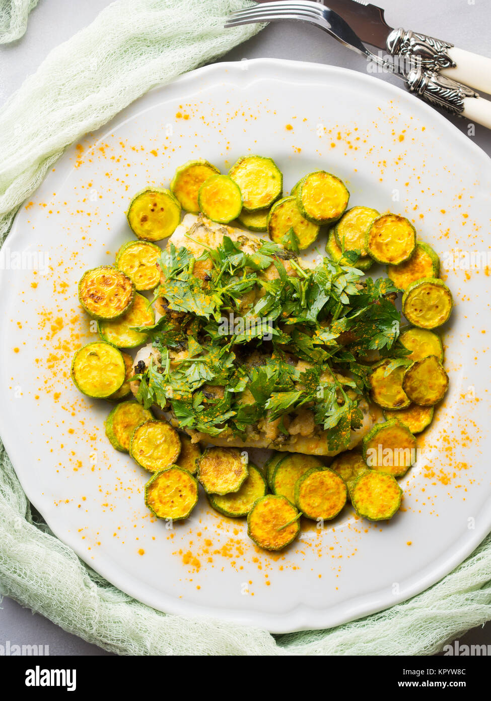 Baked Stock fish fillet with almond parsley topping and turmeric ...