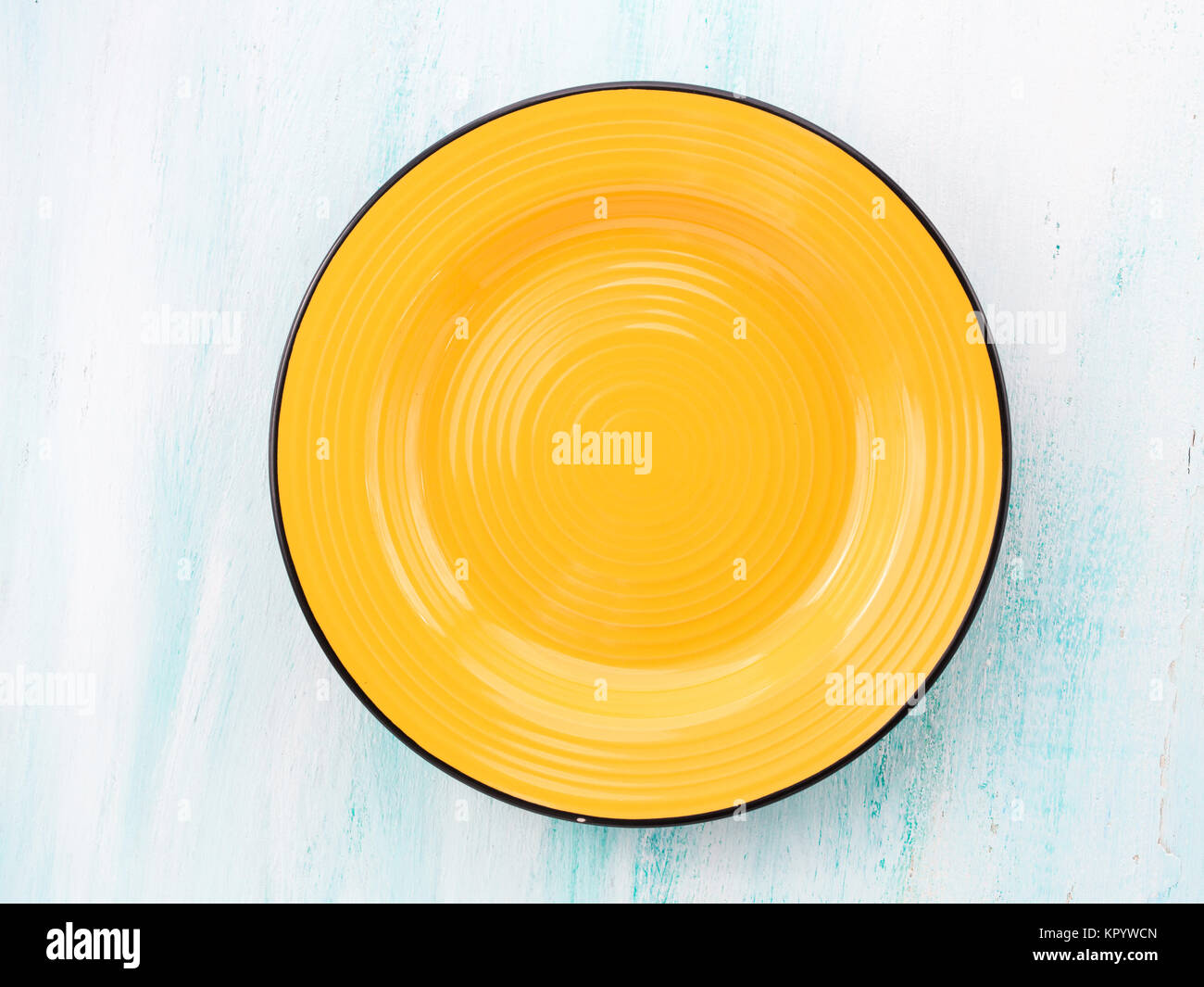 Pastel Color yellow ceramic plate dish top view background Stock Photo ...