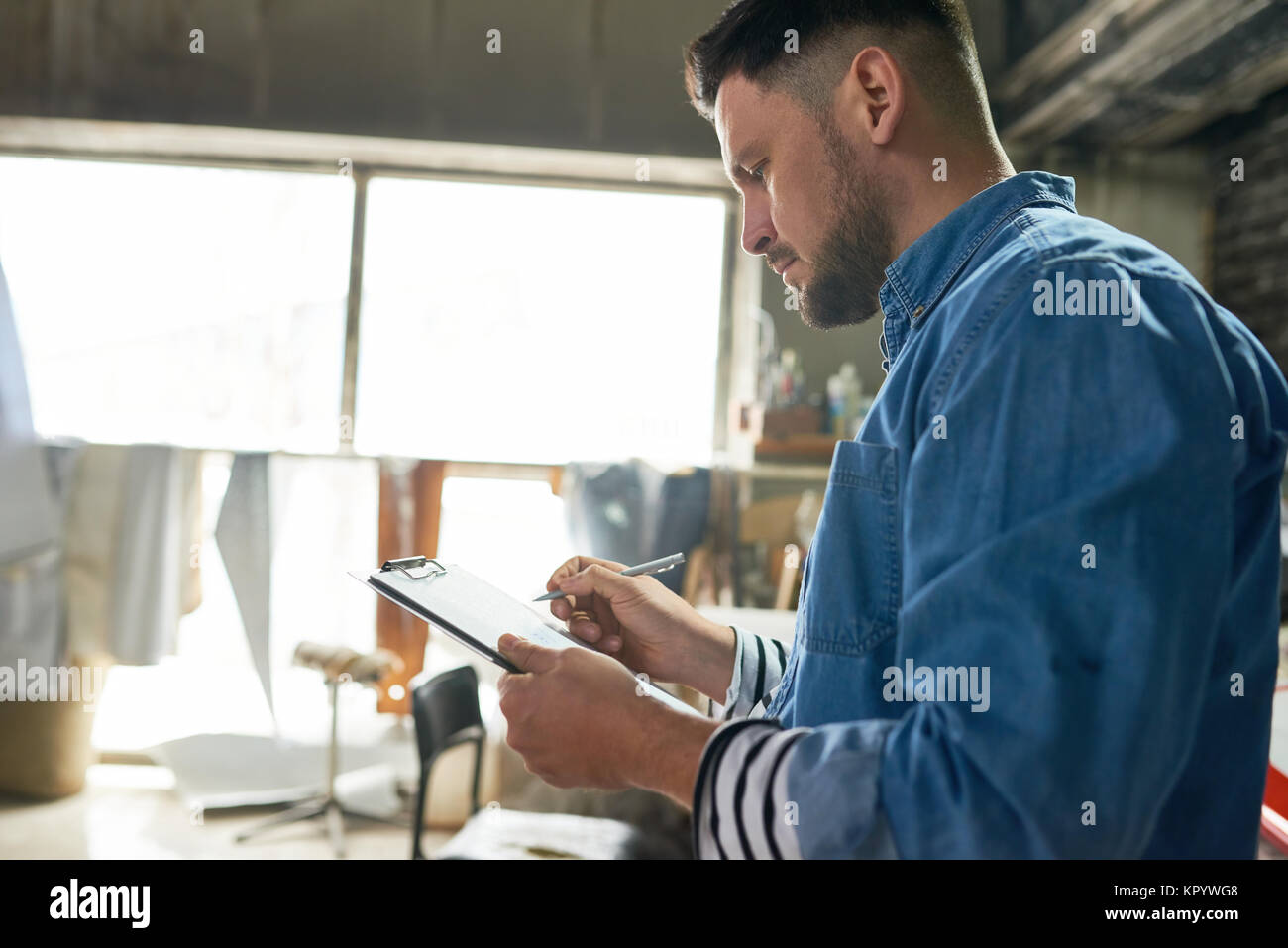 Handsome Man Planning Project in Workshop Stock Photo - Alamy