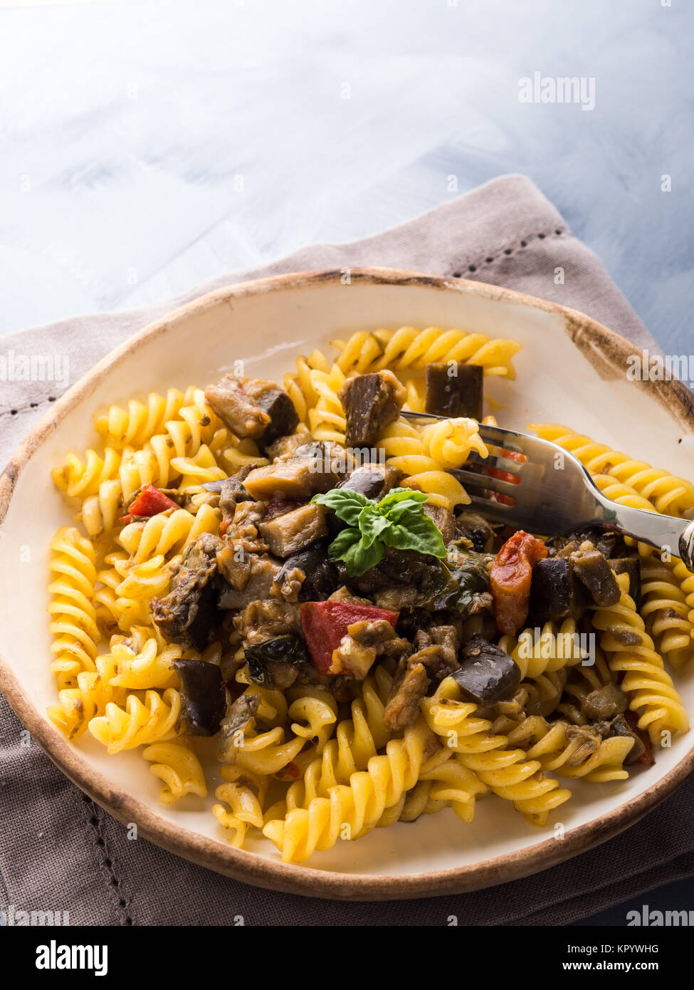 Fusilli pasta with eggplant and tomato sauce. Traditional italian dish ...