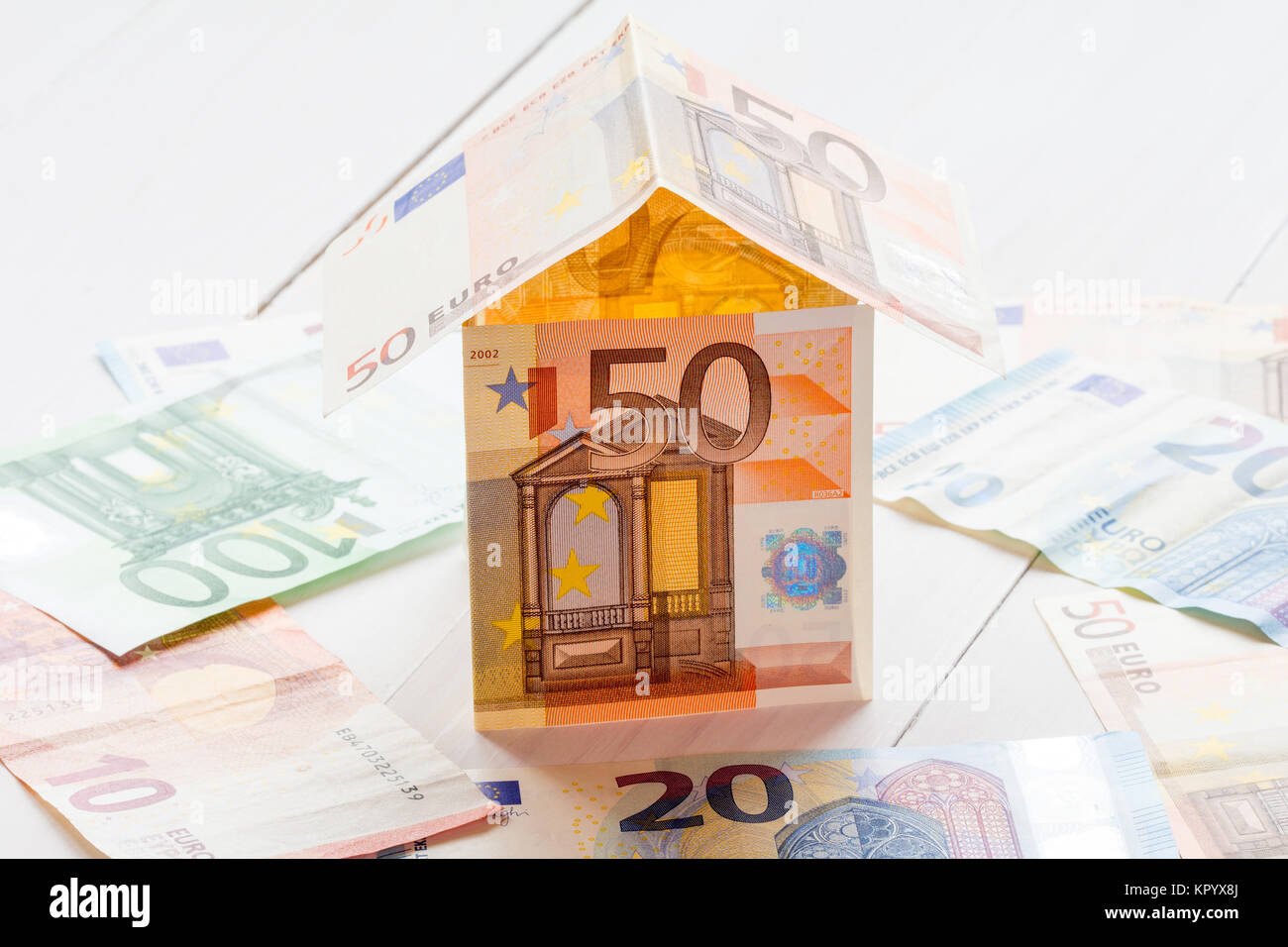 House made of Euro currency Stock Photo - Alamy