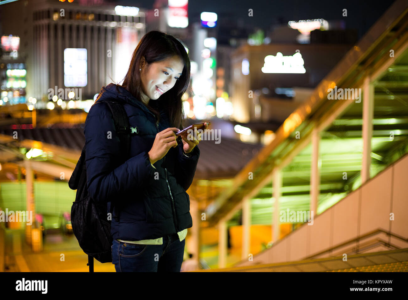 Woman use of mobile phone at night Stock Photo - Alamy