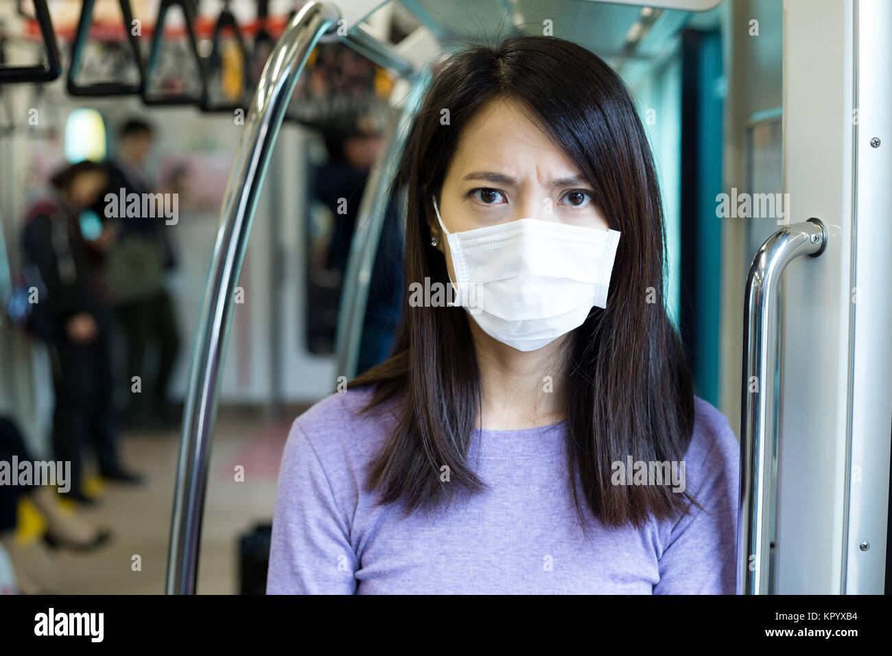 Woman wearing face mask inside train compartment Stock Photo - Alamy