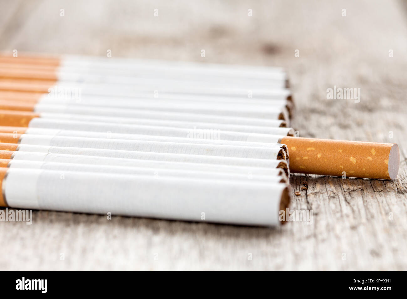 Row of cigarettes with selective focus Stock Photo - Alamy