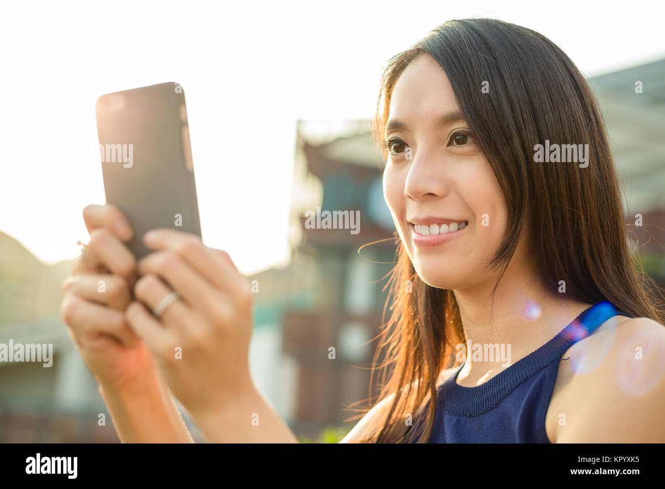 Woman using cellphone at outdoor Stock Photo - Alamy