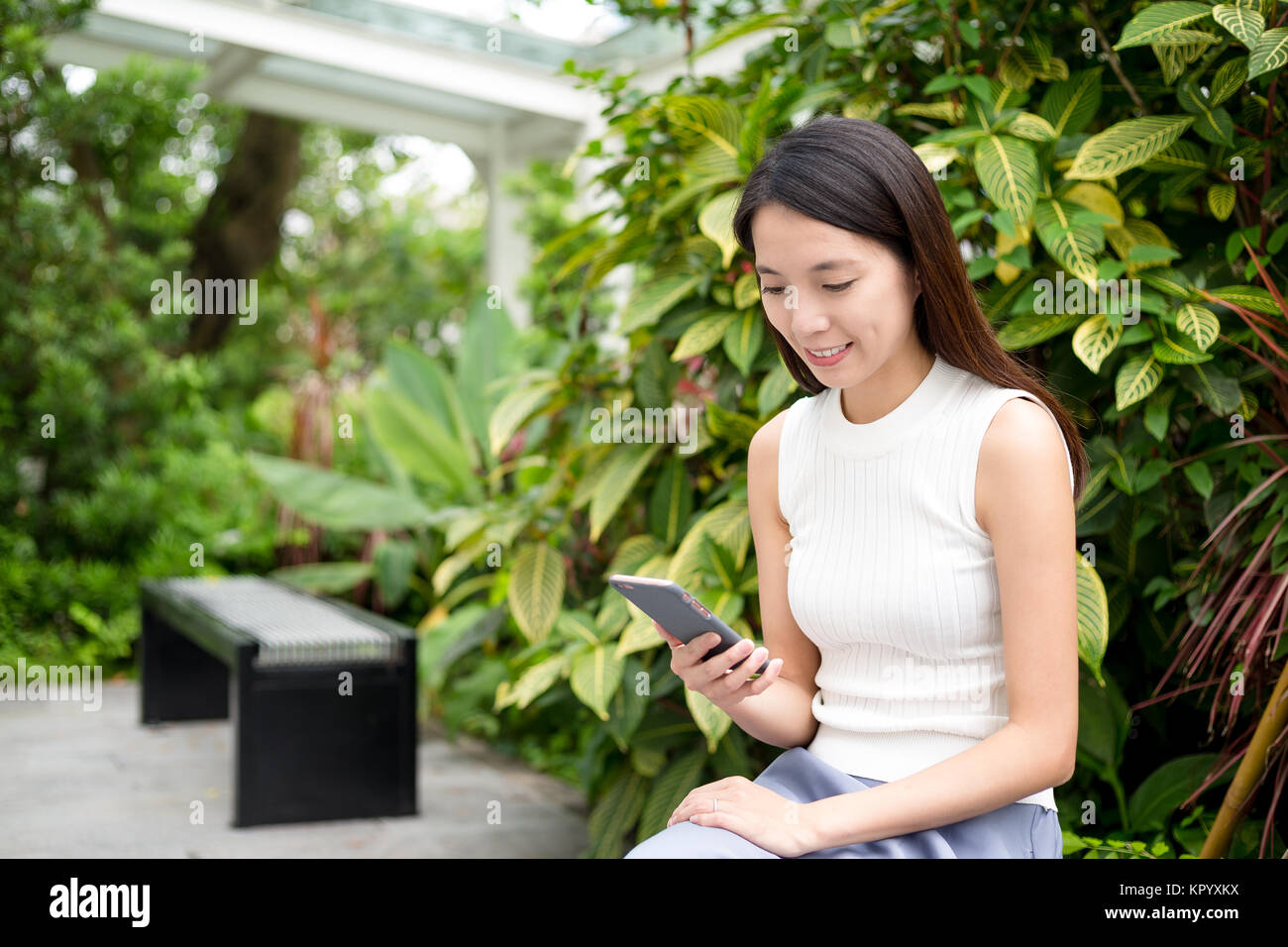 Woman use of mobile phone Stock Photo - Alamy