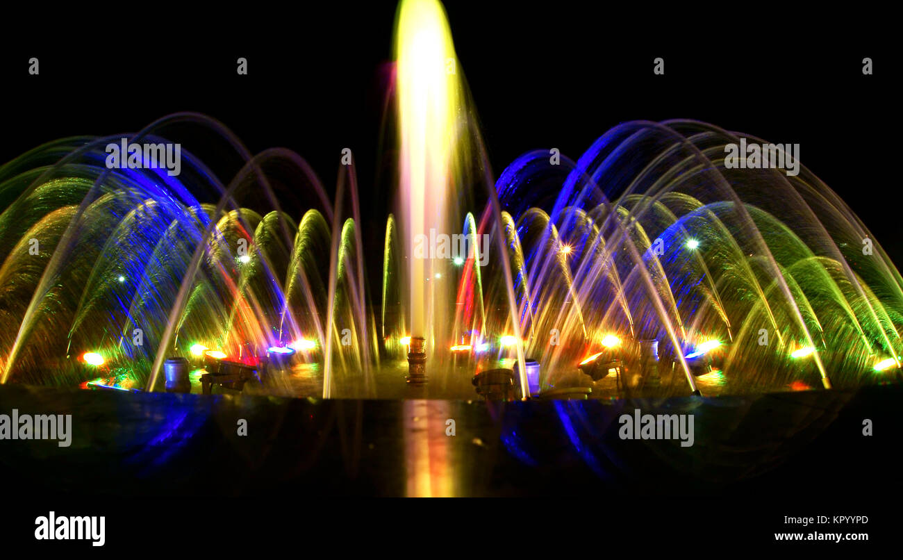 Dancing fountain at night, mix color Stock Photo - Alamy