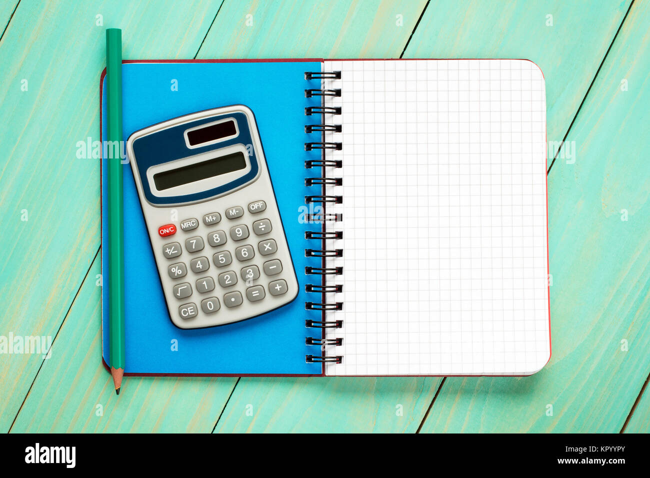 Calculator,pencil and open notebook Stock Photo - Alamy