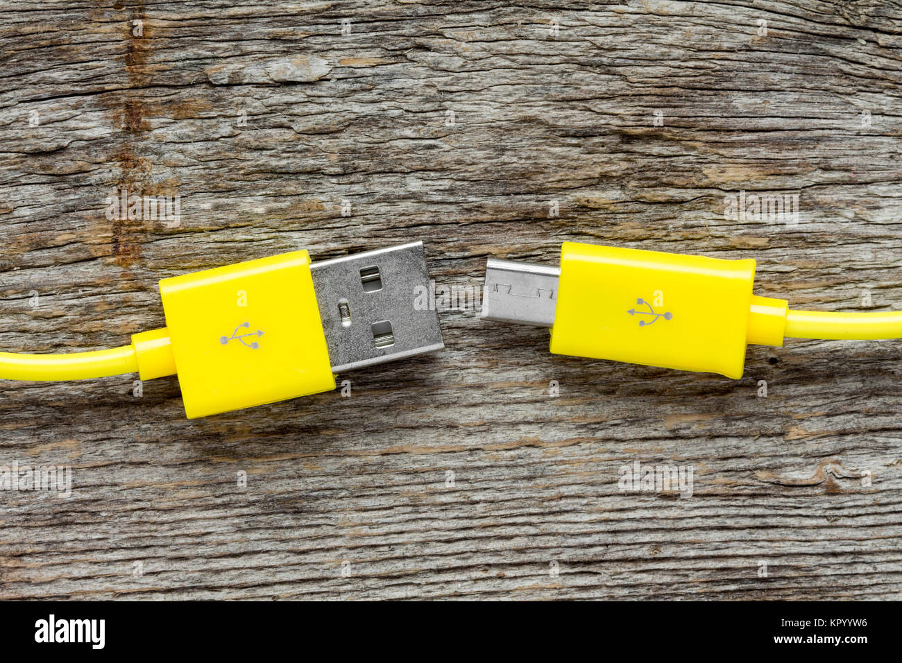 Yellow USB cable close-up Stock Photo - Alamy