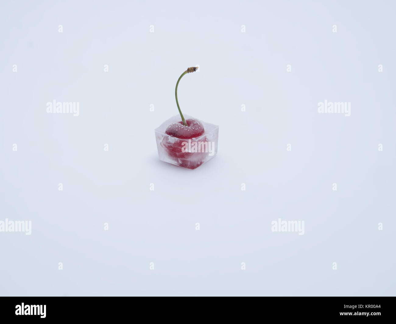 cherry frozen in ice cube Stock Photo - Alamy