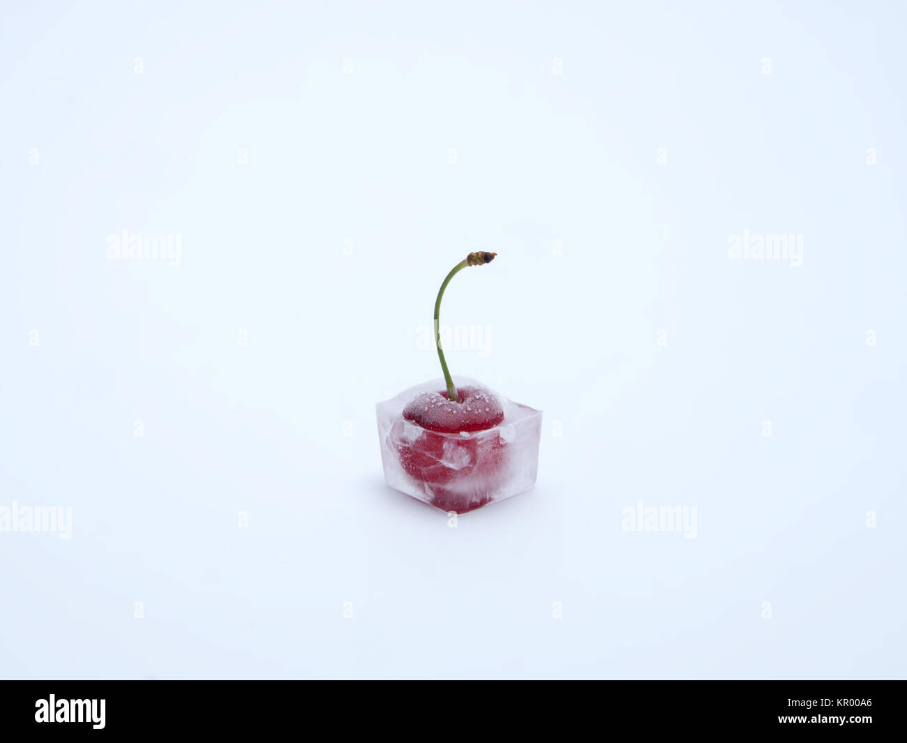 cherry frozen in ice cube Stock Photo - Alamy