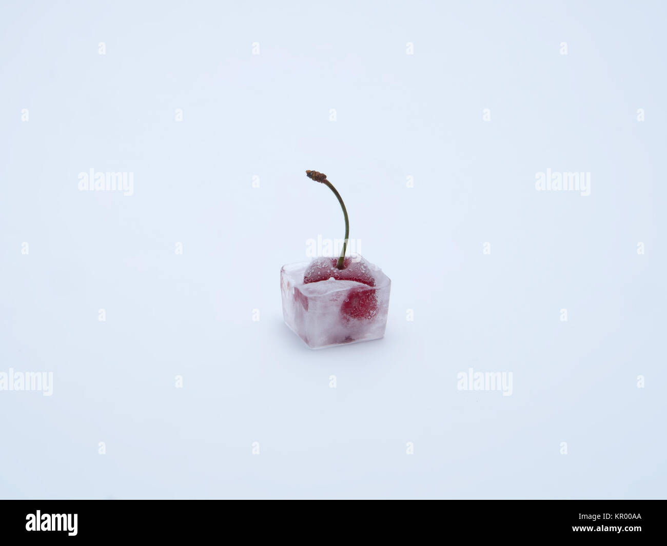 cherry frozen in ice cube Stock Photo - Alamy