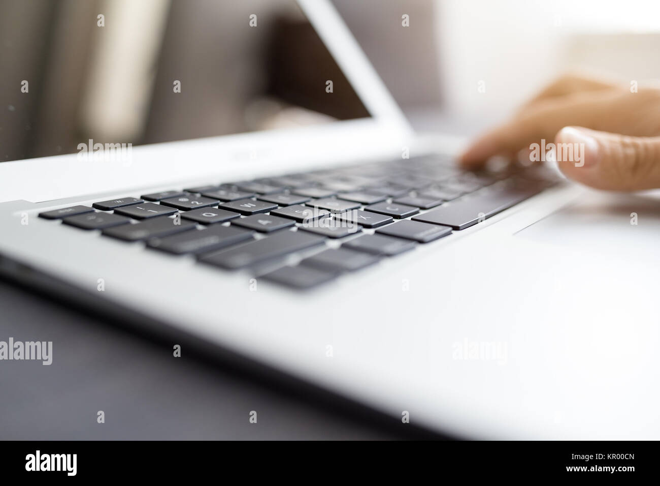 Human hands working on laptop Stock Photo - Alamy