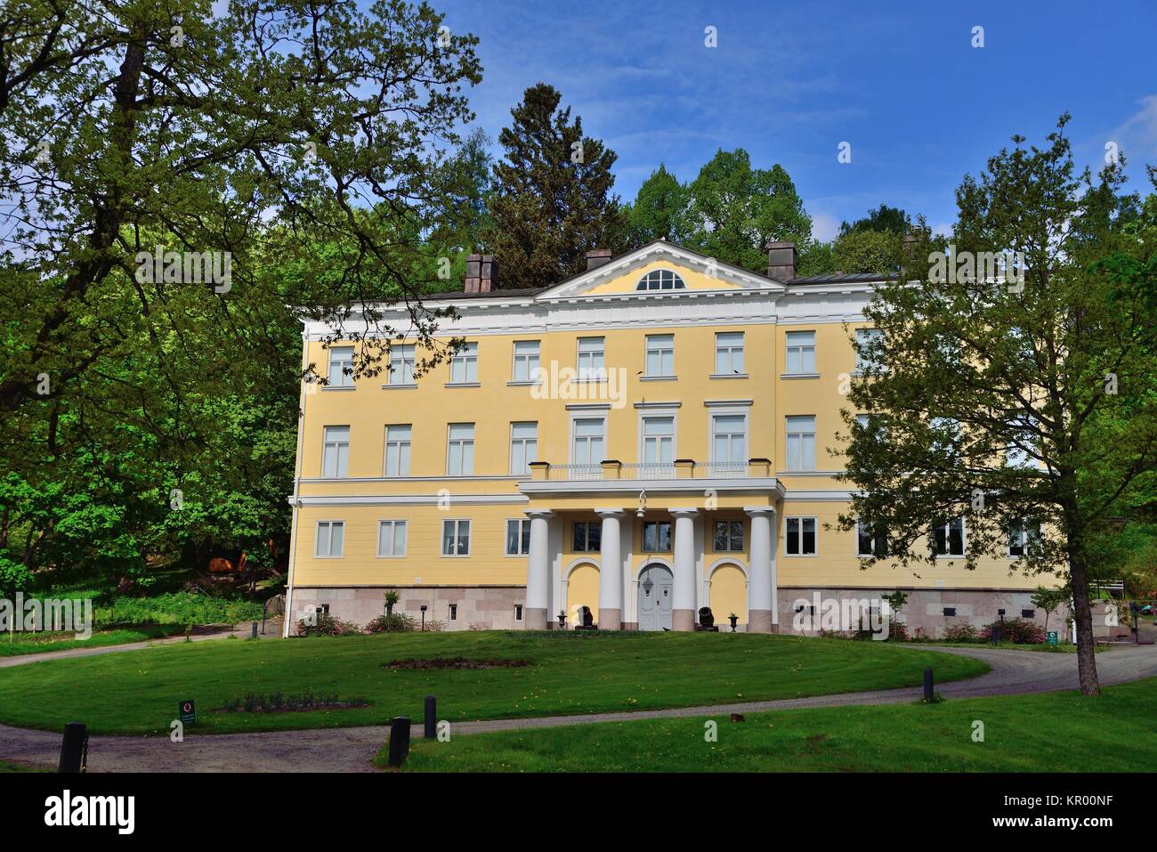Yellow old manor with a garden Stock Photo - Alamy